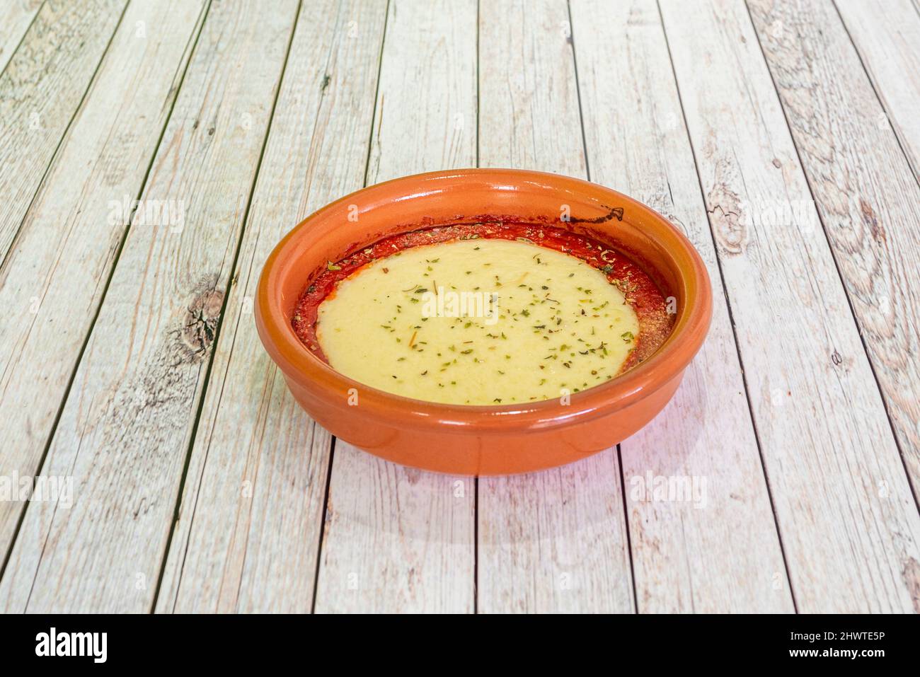 La provoleta est une roue de fromage provolone qui est une tradition en ...