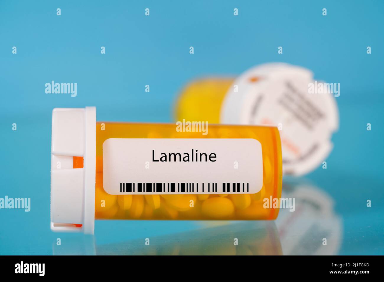 Lamaline. Comprimés de Lamaline dans le flacon de médicament de ...