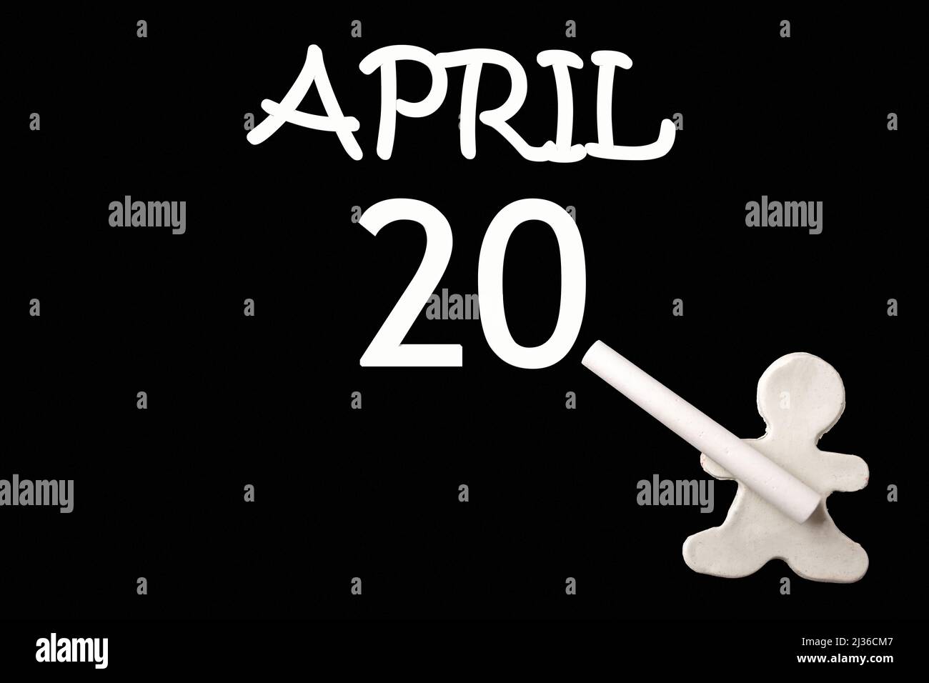 20th jour d'avril. Un petit homme de plasticité blanche écrivant la ...