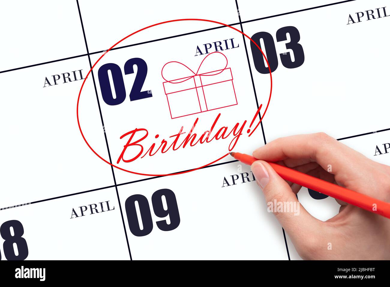 2nd jour d'avril. La main tourne la date sur le calendrier 2 avril ...