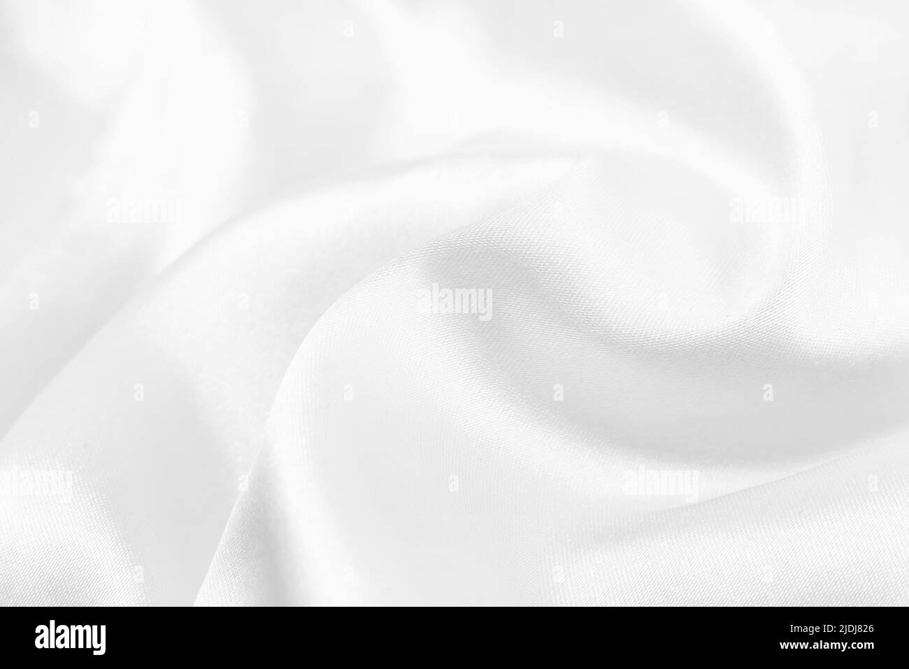 Un morceau de tissu blanc torsadé. Matériau blanc ou texture avec ...