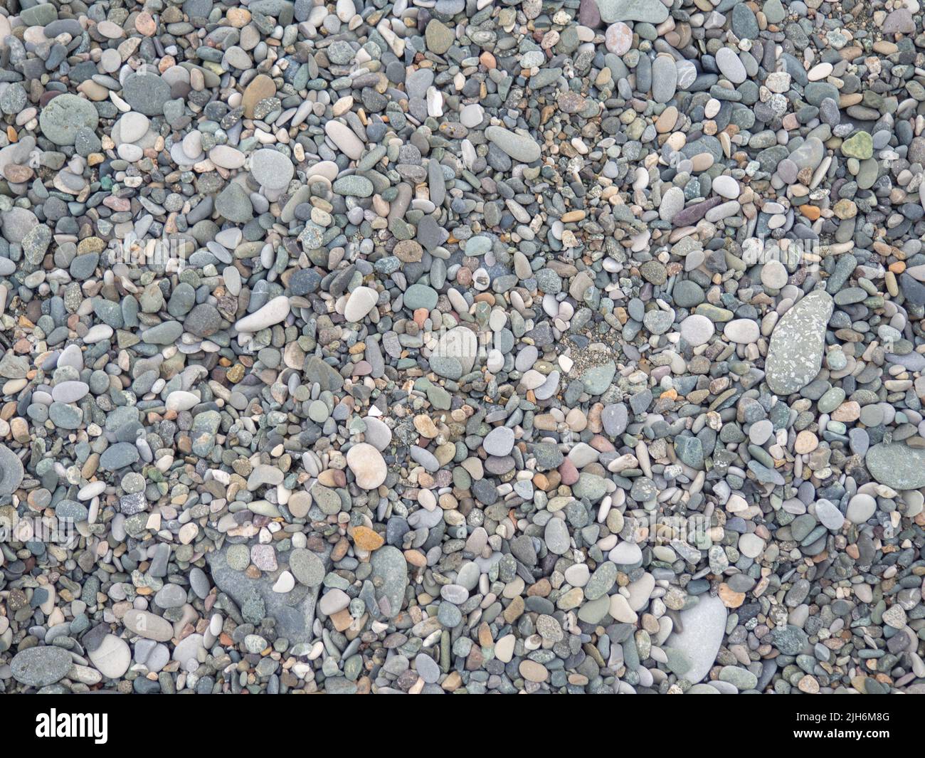 De grandes pierres sur la plage. Arrière-plan de pierres. Des rochers ...