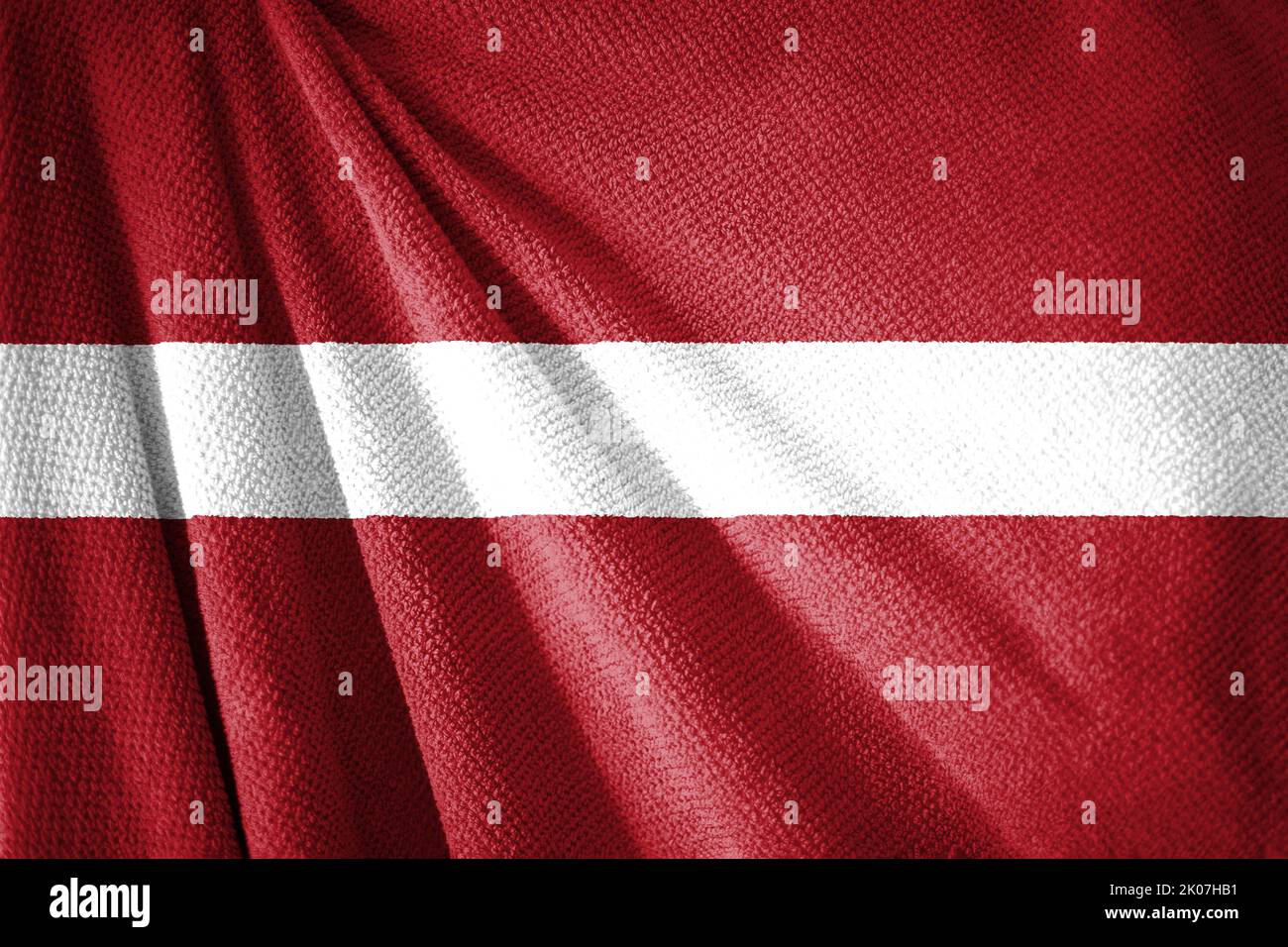 Drapeau letton sur l'illustration de la surface de la serviette avec ...