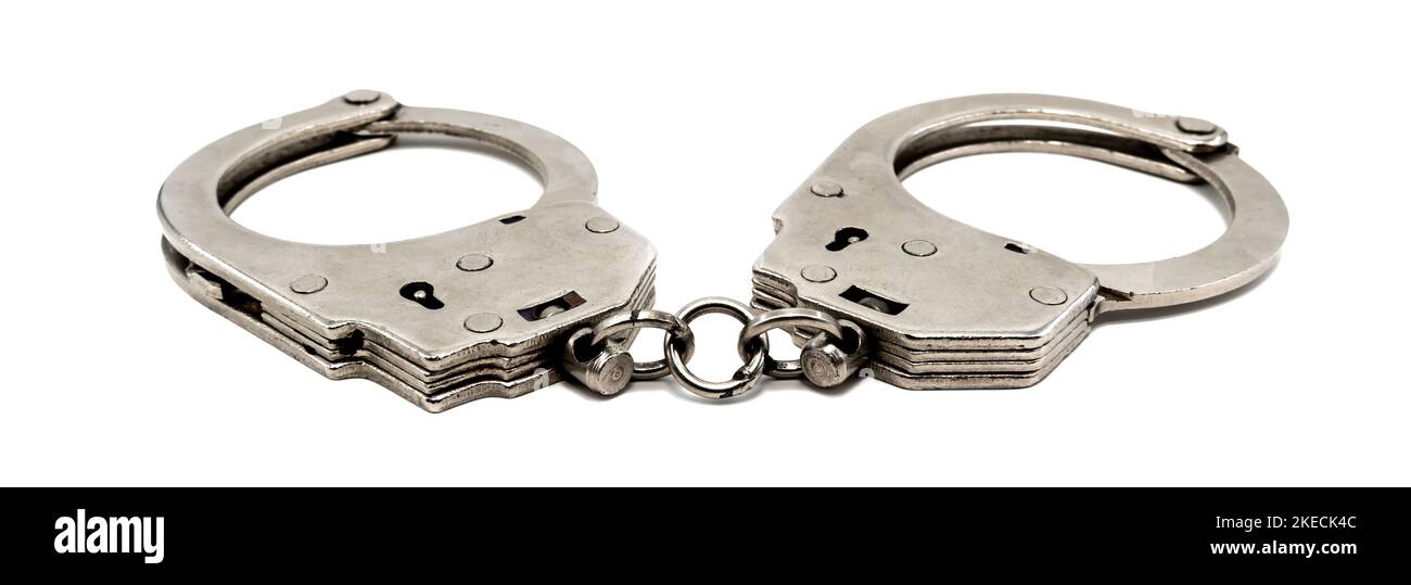 Menottes sur fond blanc. Menottes isolées. Loi. Crime Photo Stock - Alamy