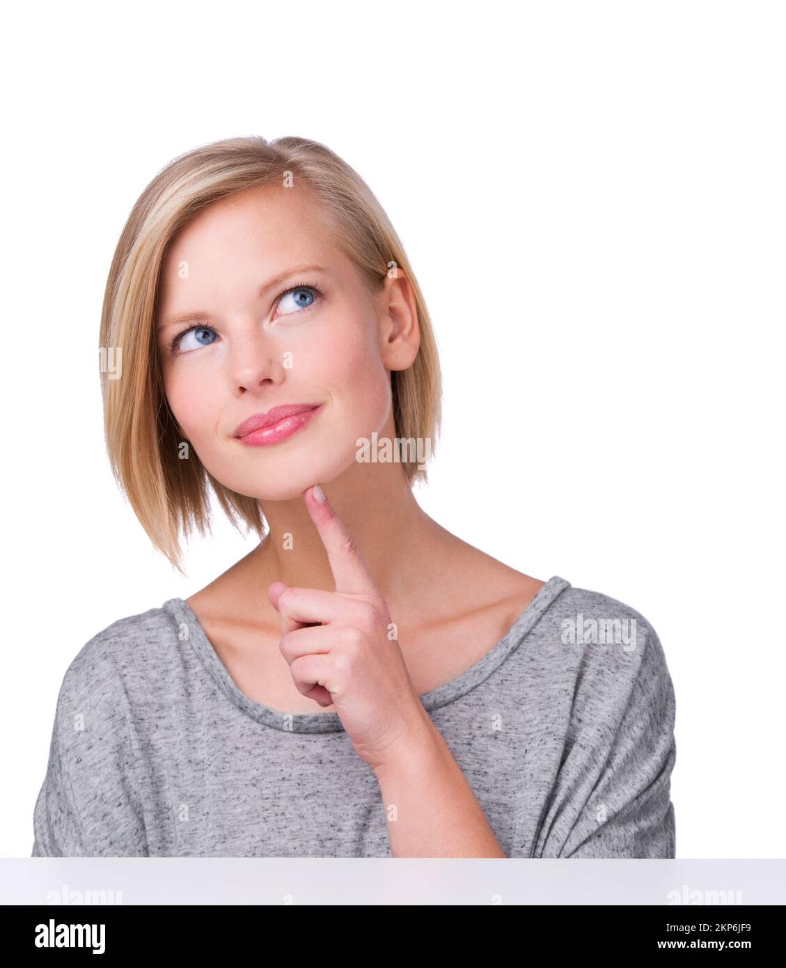 Je me demande... une photo studio isolée d'une belle jeune femme qui a ...
