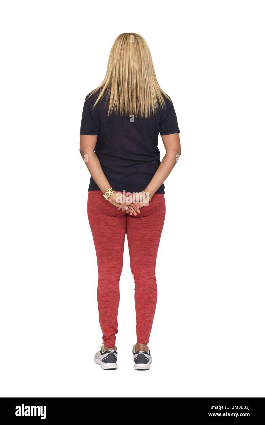 vue arrière d'une femme en vêtements de sport avec ses mains croisées ...
