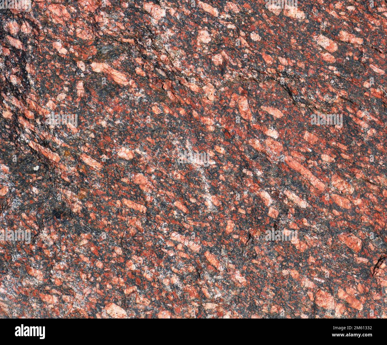 Arrière-plan de texture de granit rouge avec de petits cristaux et ...