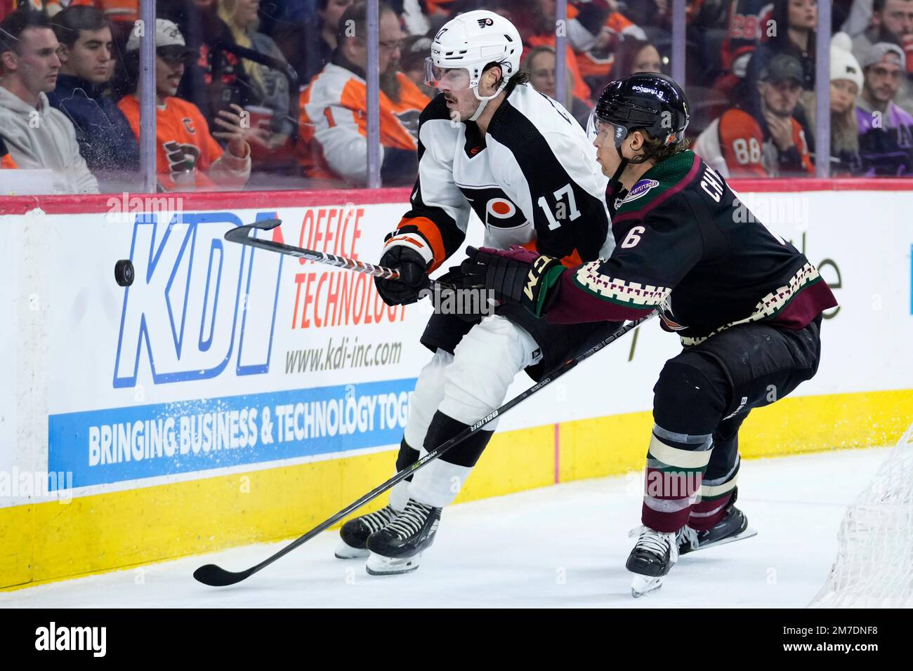 Philadelphia Flyers' Zack MacEwen, left, and Arizona Coyotes' Jakob ...