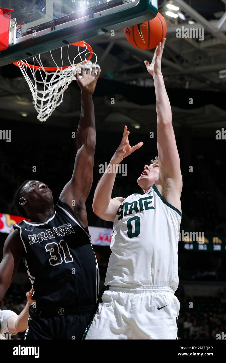Michigan State's Jaxon Kohler, right, shoots against Brown's Nana Owusu ...