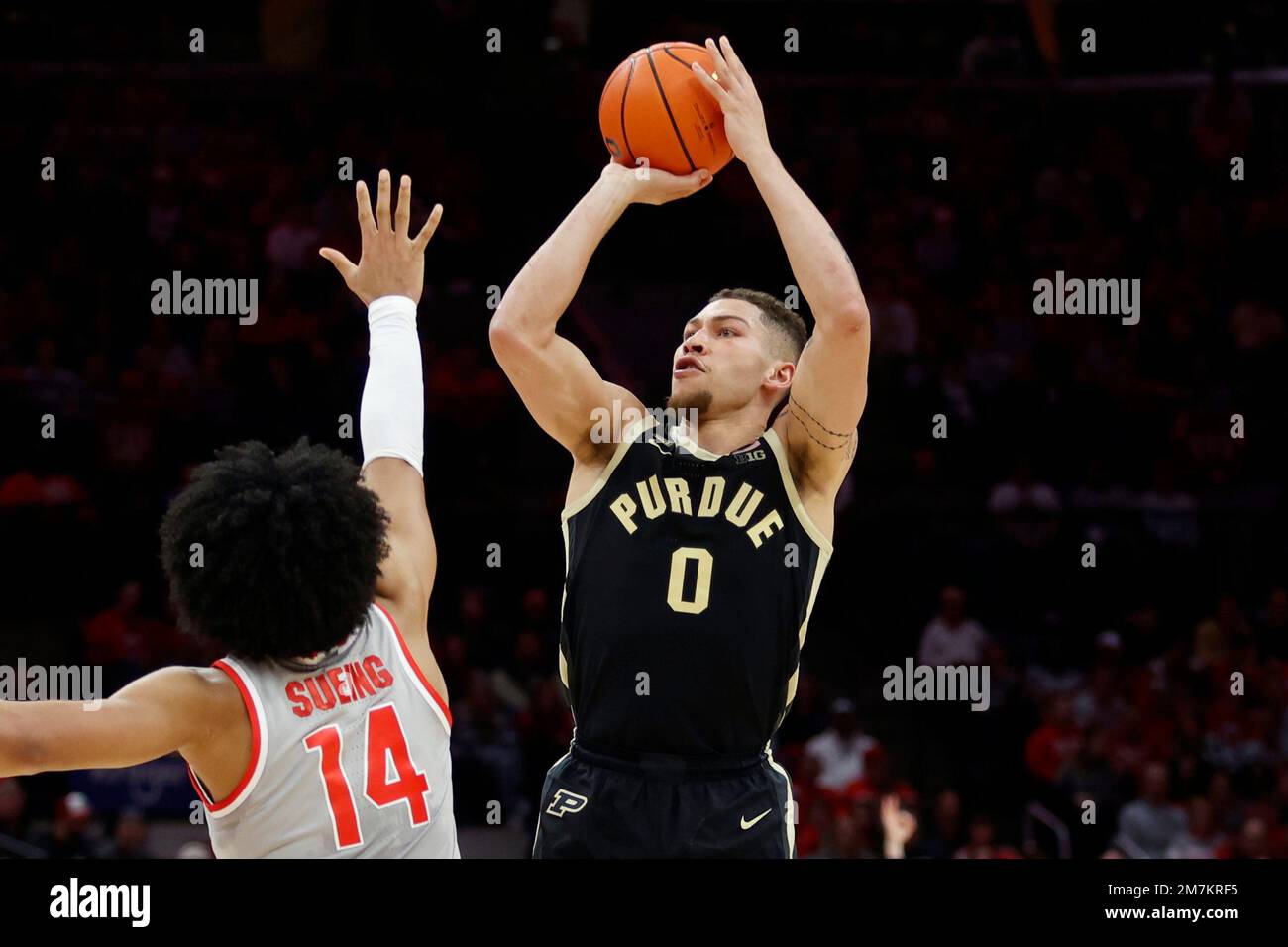 Purdue forward Mason Gillis, right, shoots in front of Ohio State guard ...