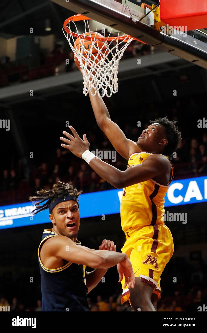 Minnesota forward Joshua Ola-Joseph (1) shoots over Michigan forward ...