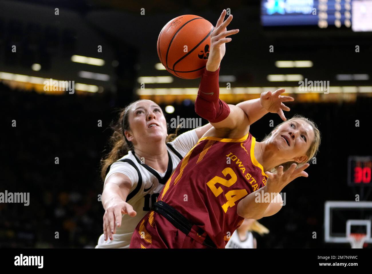 Iowa forward McKenna Warnock, left, fights for a rebound with Iowa ...