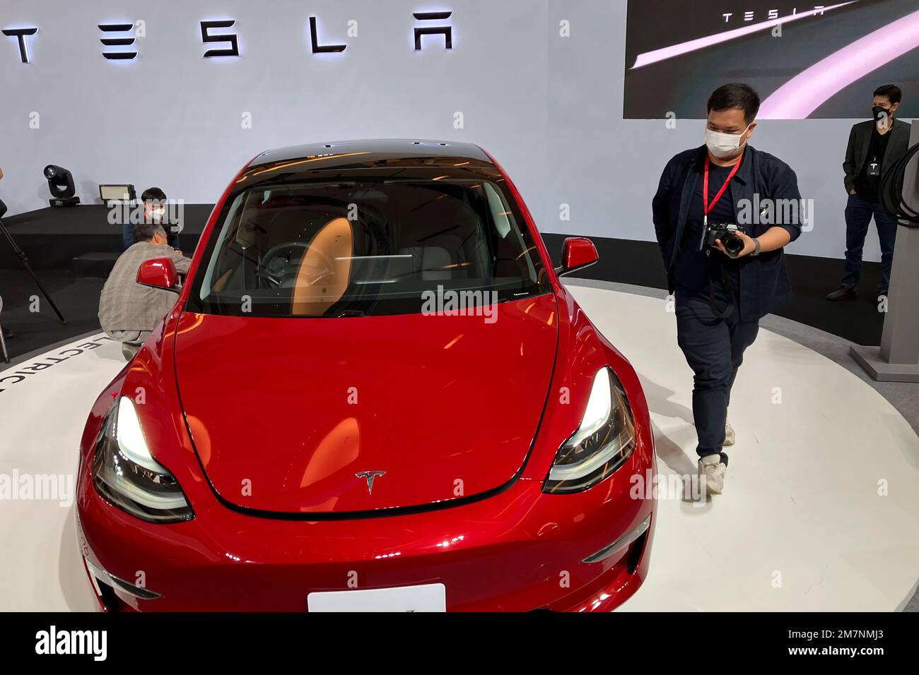 Tesla electric vehicles are displayed during a public launching event ...