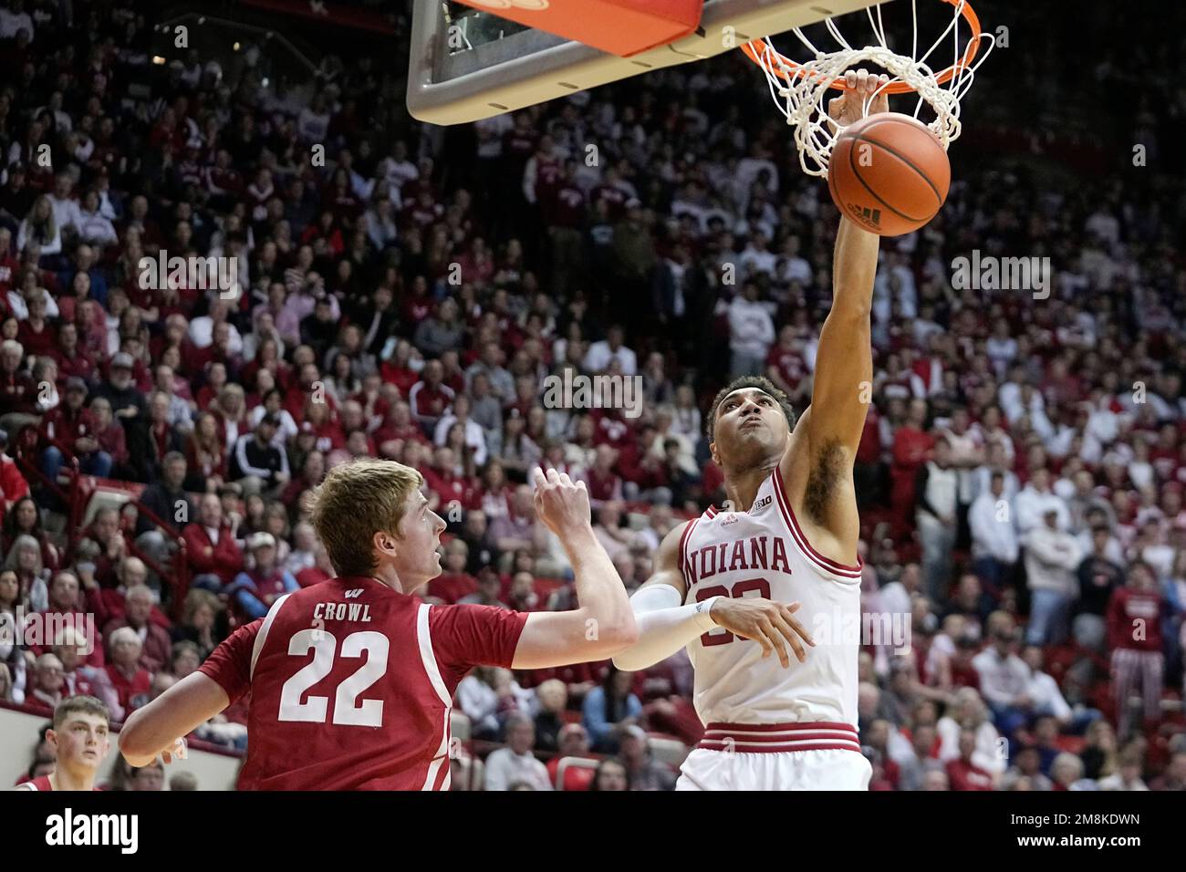 Indiana's Trayce Jackson-Davis (23) dunks over Wisconsin's Steven Crowl ...