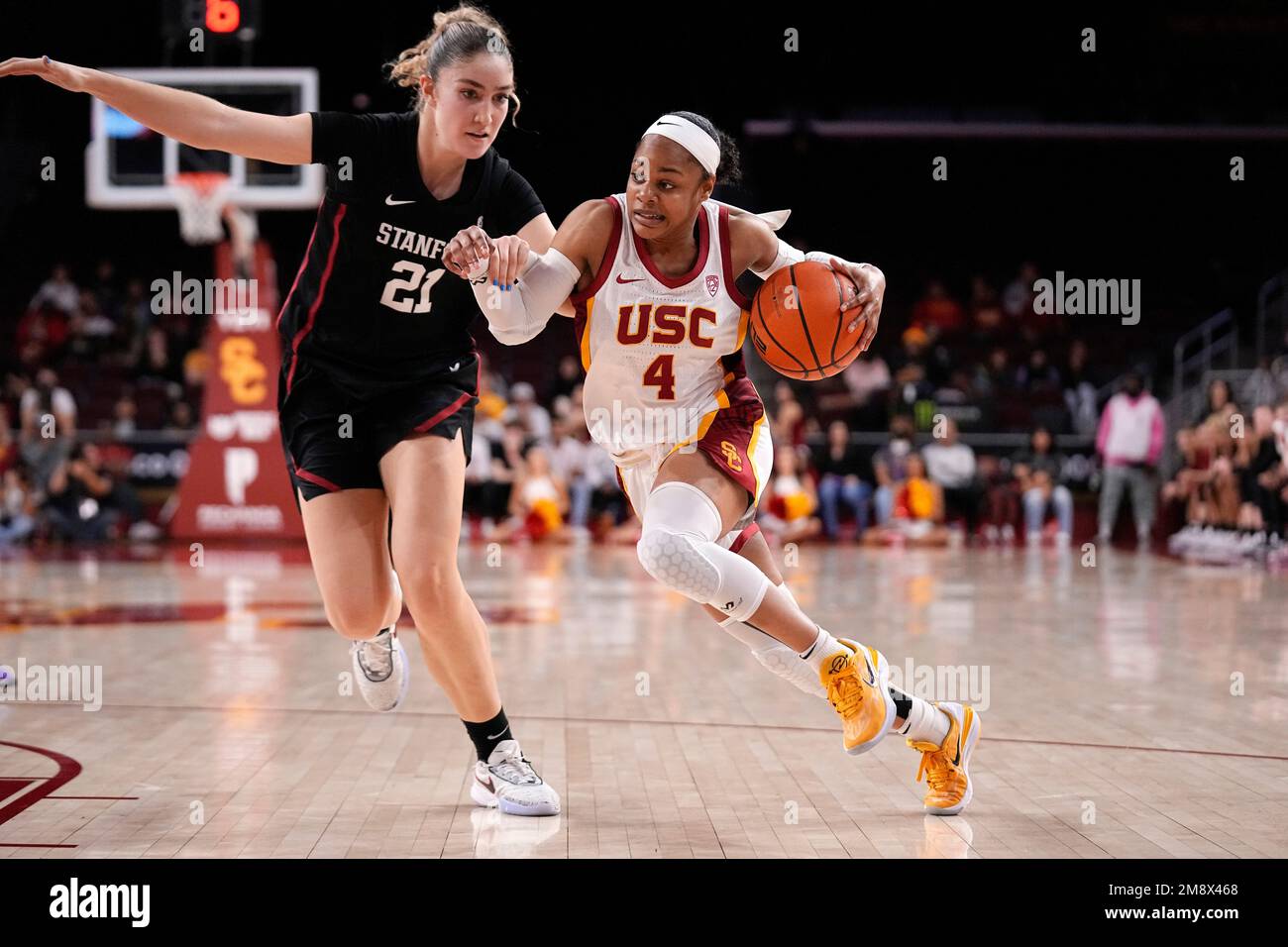 Southern California guard Kayla Williams, right, drives to the basket ...