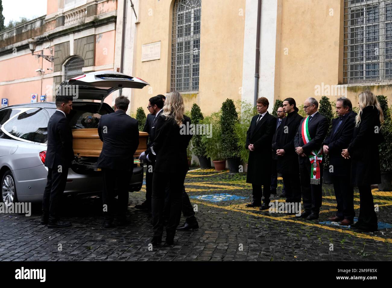 Rome's mayor Roberto Gualtieri, center, is flanked by relatives and ...