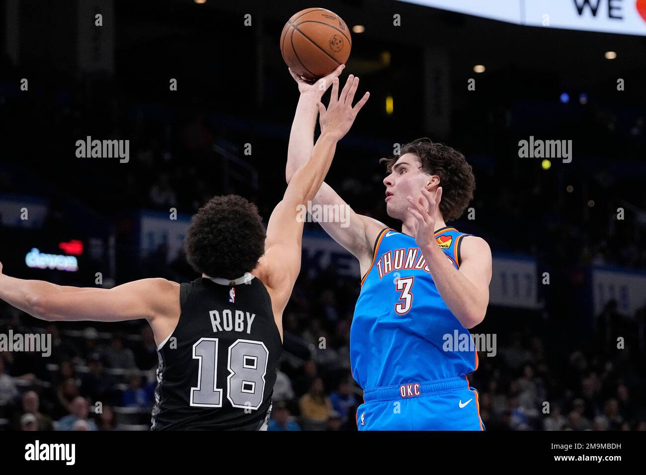 Oklahoma City Thunder guard Josh Giddey (3) shoots over San Antonio Spurs forward Isaiah Roby ...