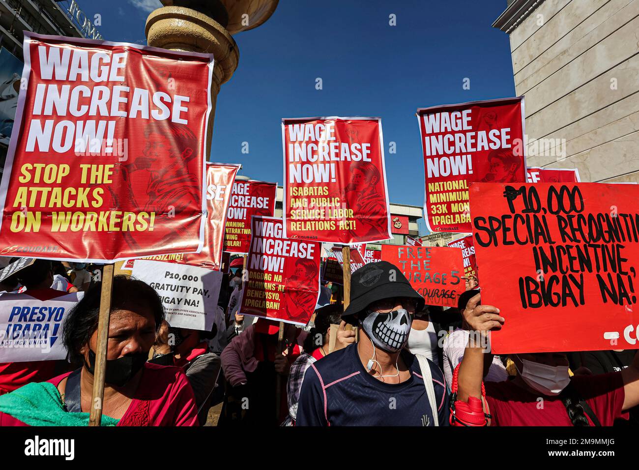 Workers march during a labor march on Bonifacio Day, Wednesday, Nov. 30 ...