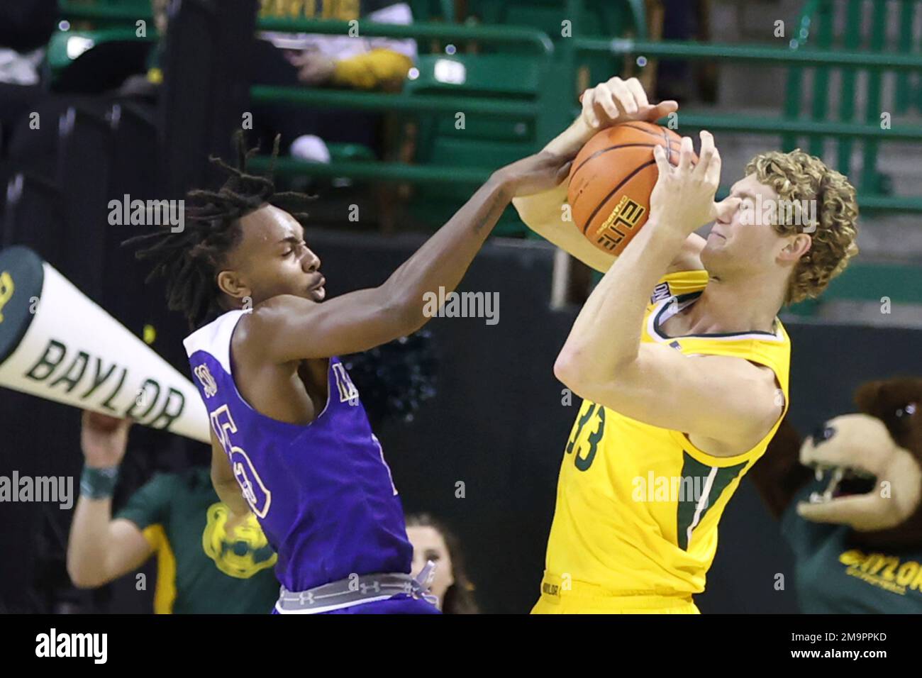 Baylor forward Caleb Lohner (33) battles McNeese State guard Zach Scott ...