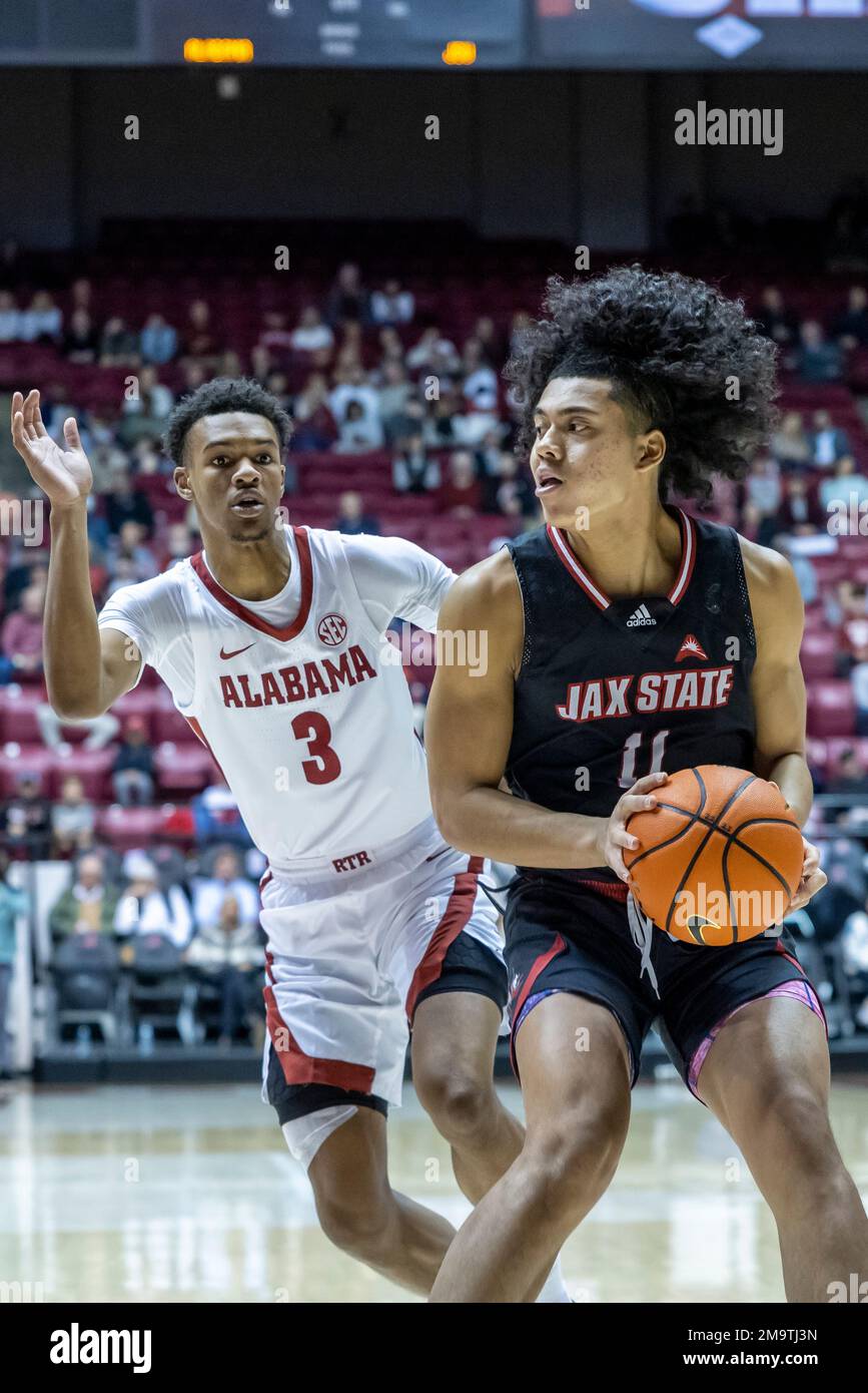 Jacksonville State guard Travis Roberts (11) works to get off a shot as ...
