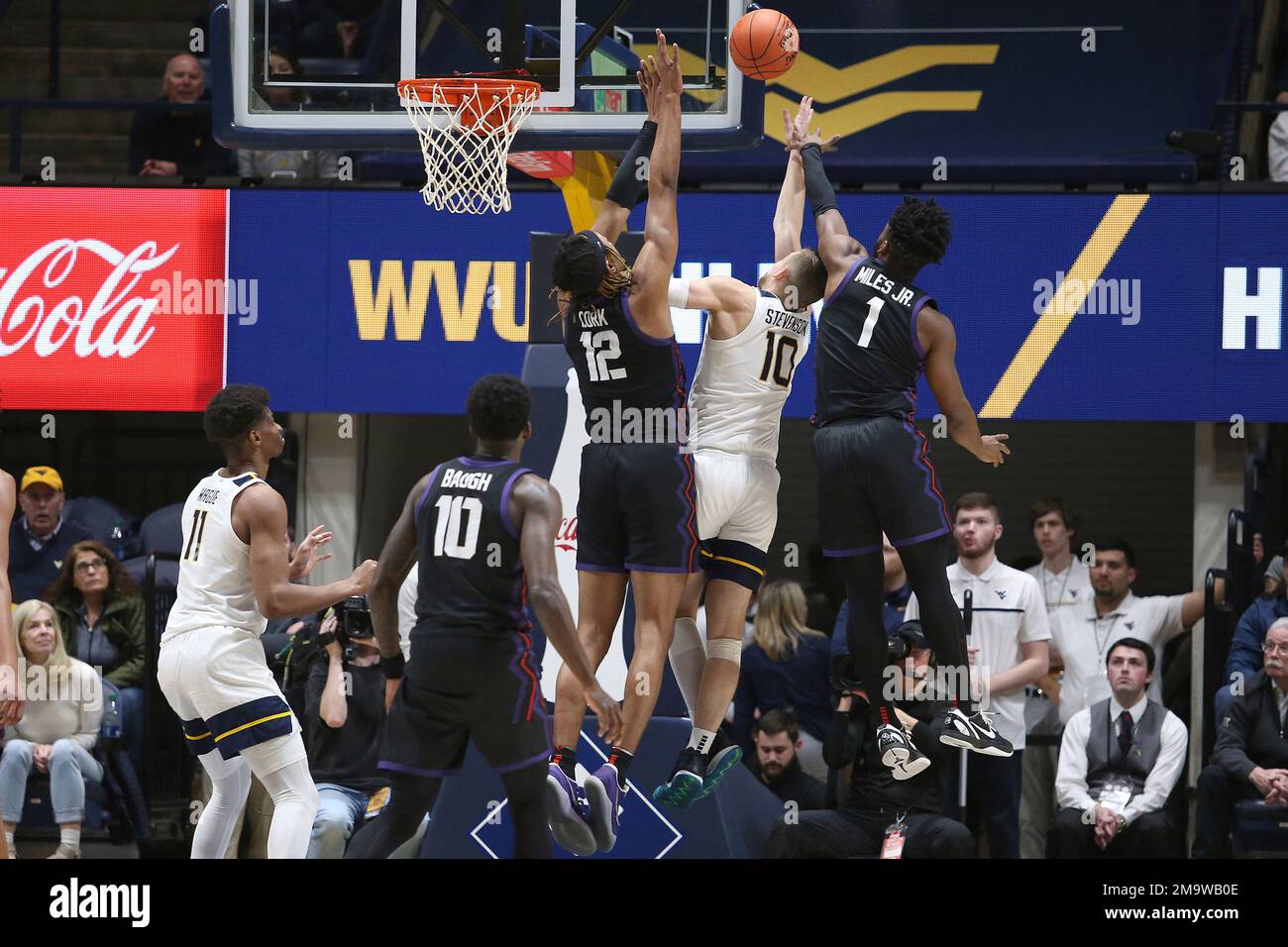 West Virginia guard Erik Stevenson (10) shoots between TCU forward ...