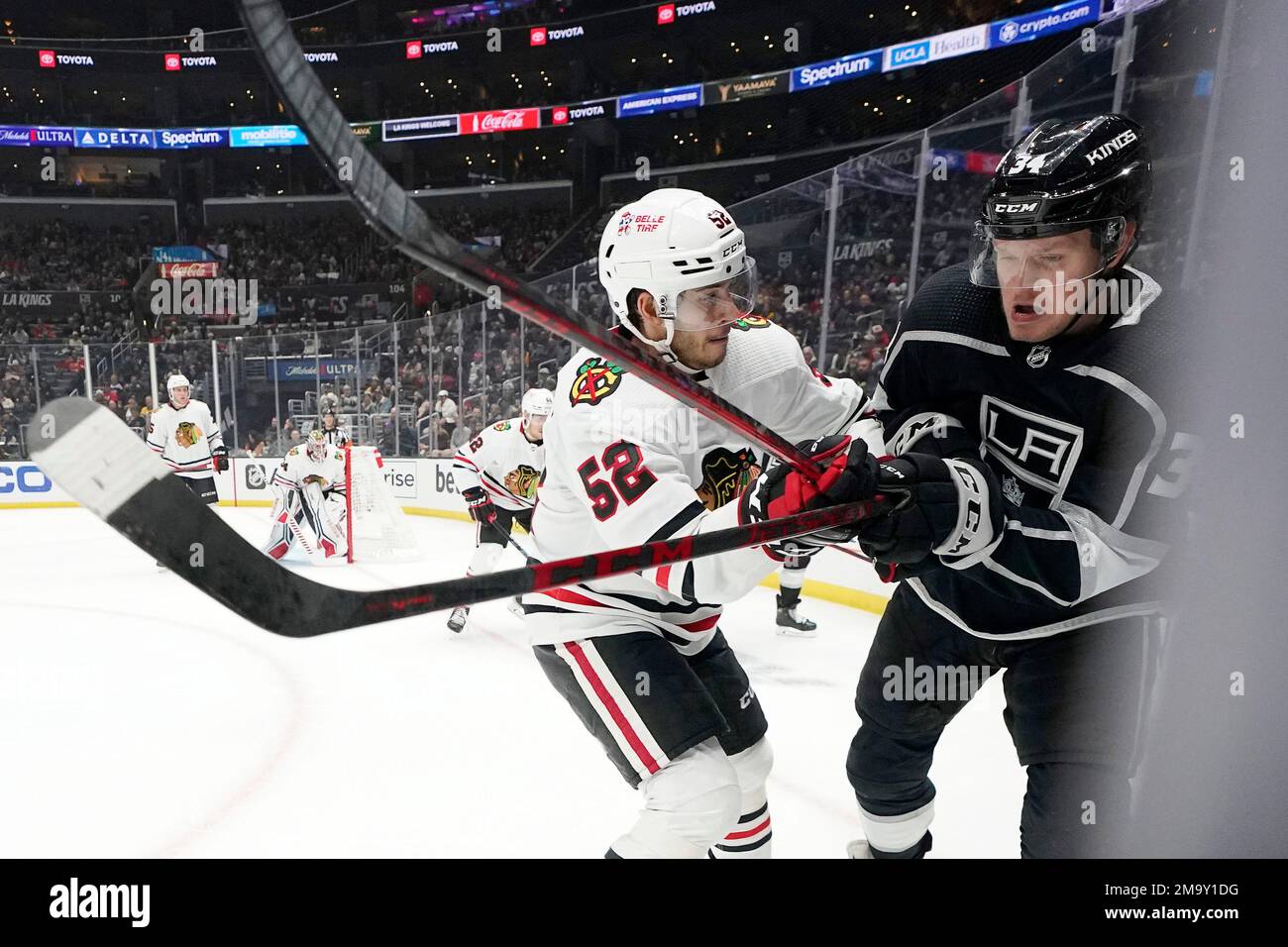 Chicago Blackhawks center Reese Johnson, left, and Los Angeles Kings ...