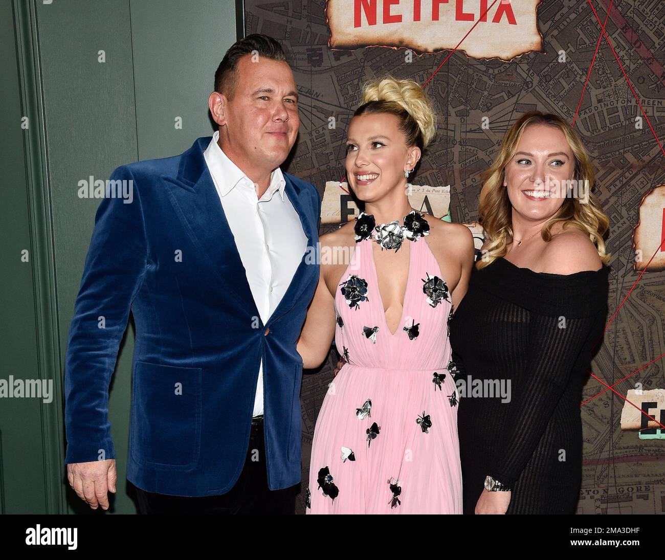 Millie Bobby Brown, center, poses with her father Robert Brown, left ...