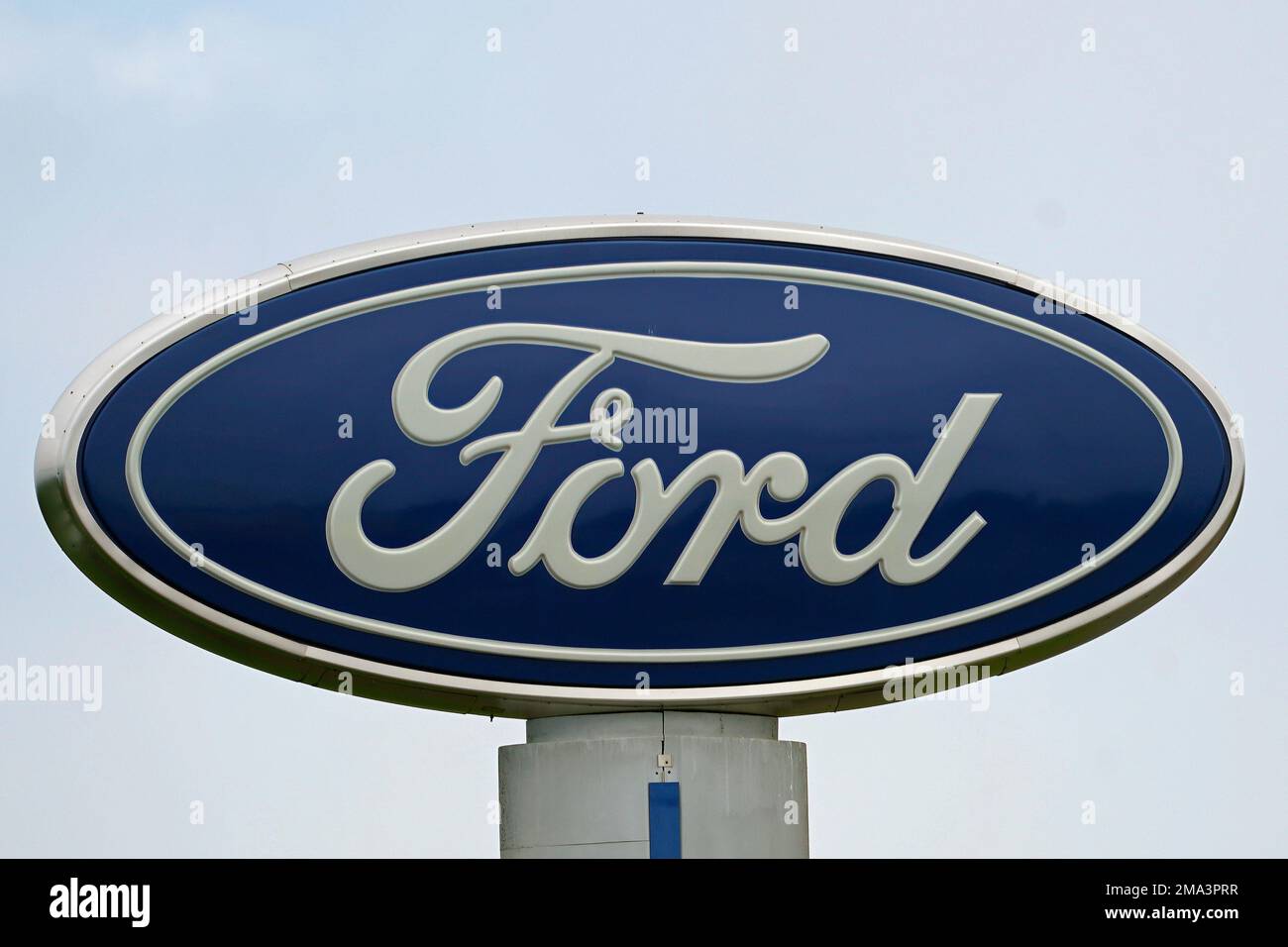 FILE - A Ford logo is seen on signage at Country Ford in Graham, N.C ...