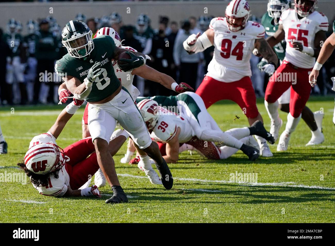 Michigan State running back Jalen Berger (8) breaks away from Wisconsin ...