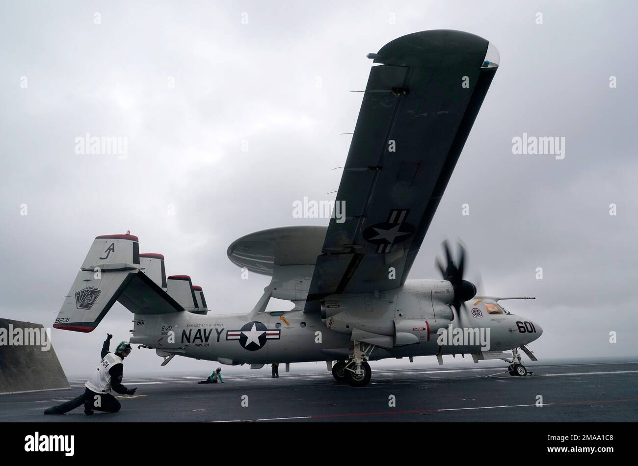 A US Navy E-2 Hawkeye Airborne Command and Control aircraft is launched ...