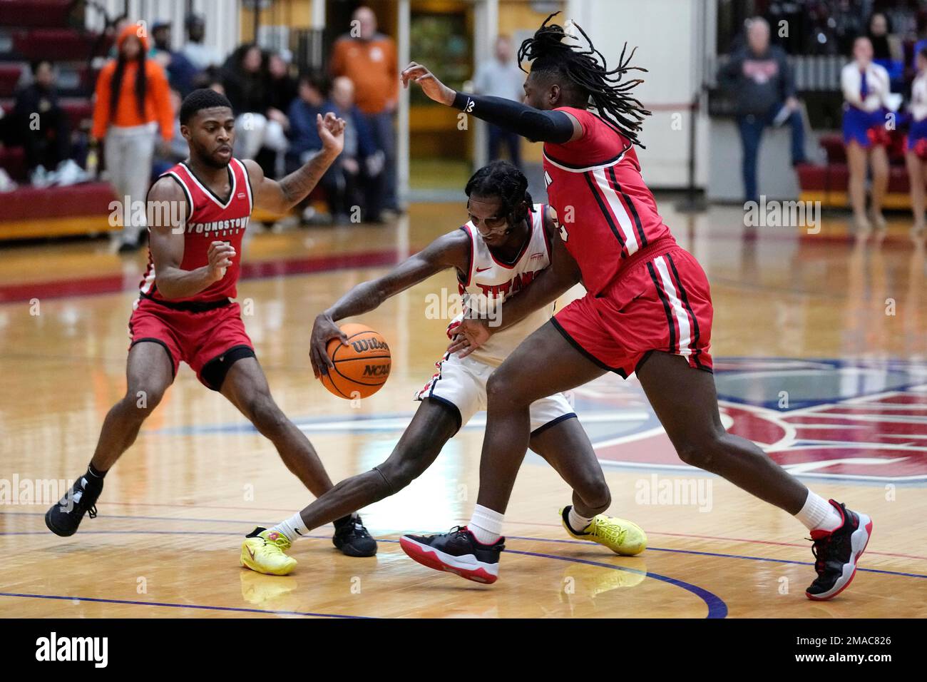 Detroit Mercy guard Antoine Davis is double teamed by Youngstown State ...
