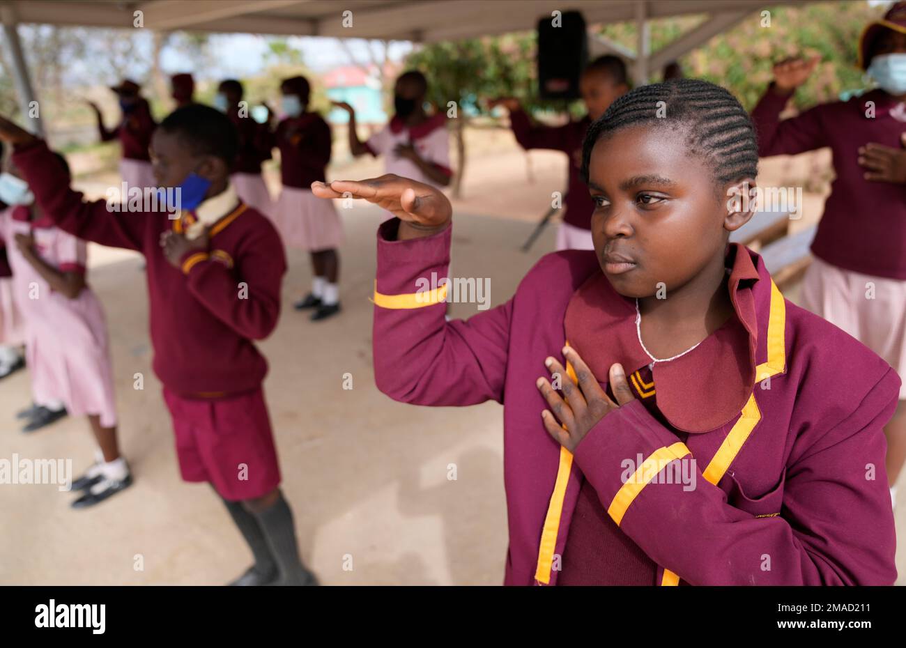 Schoolchildren sing the Zimbabwe National Anthem in Sign Language at a ...