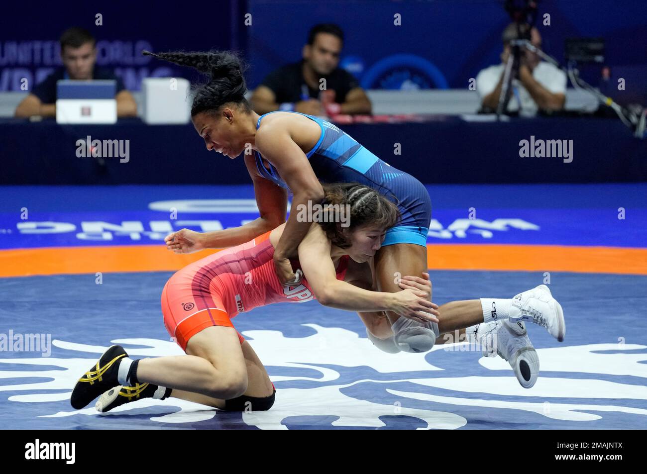 Japan's Mayu Shidochi Mukaida, left, and Jacarra Gwenisha Winchester of USA compete in their ...