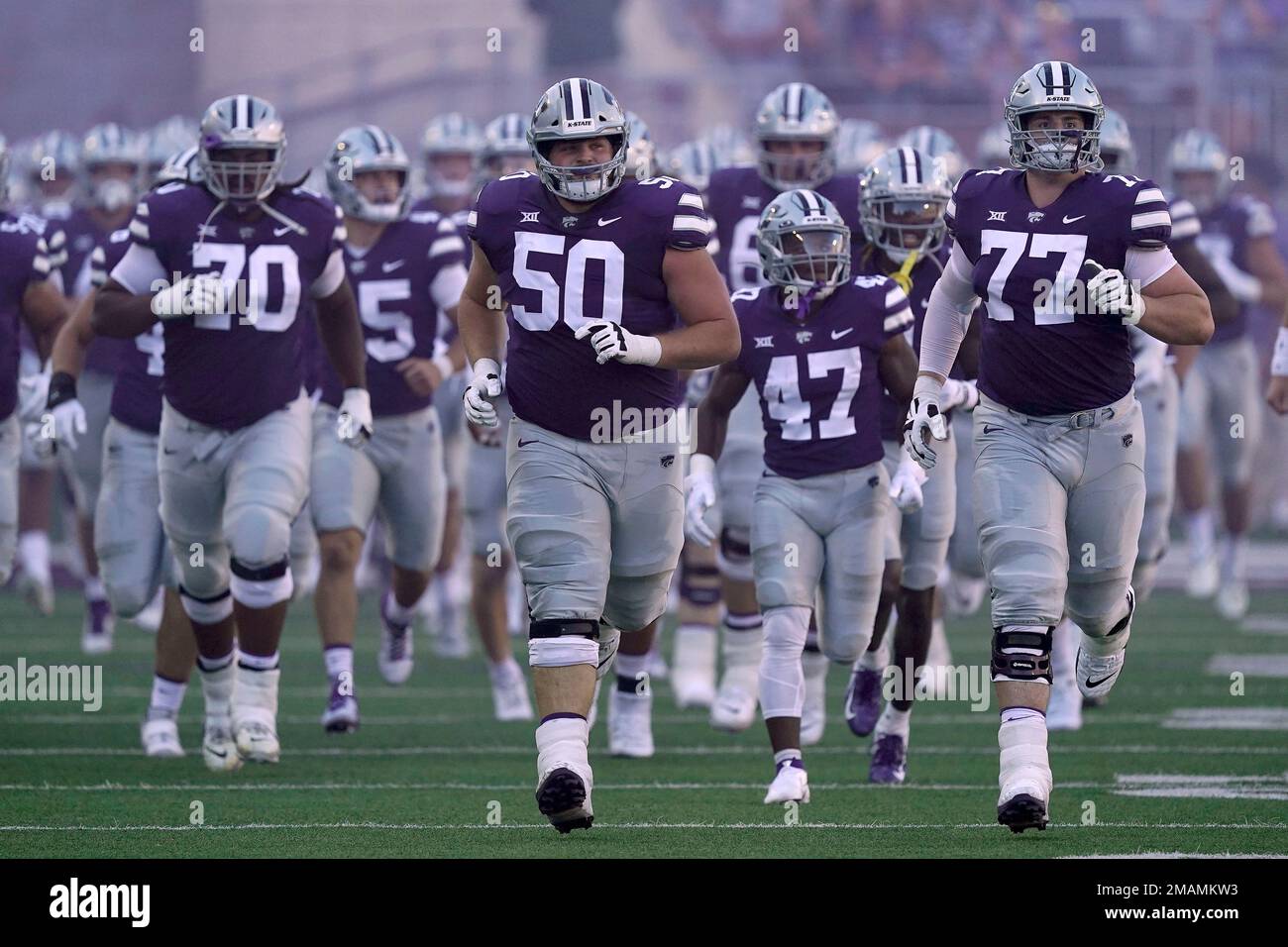 Kansas State offensive lineman Cooper Beebe (50) runs onto the field ...
