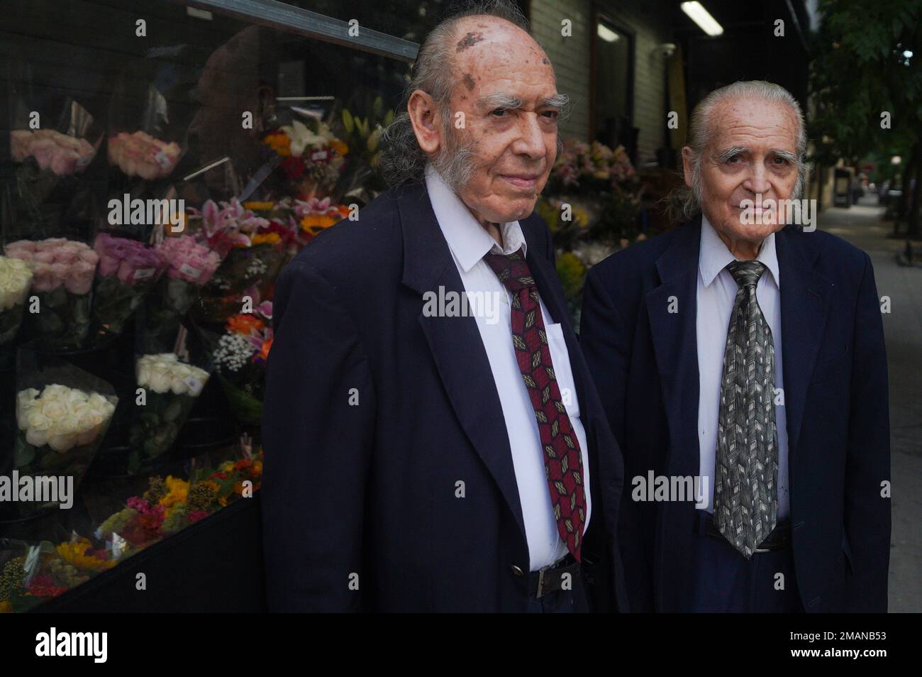 Octogenarian brothers from Ecuador, Carlos Cevallos, left, and Miguel ...