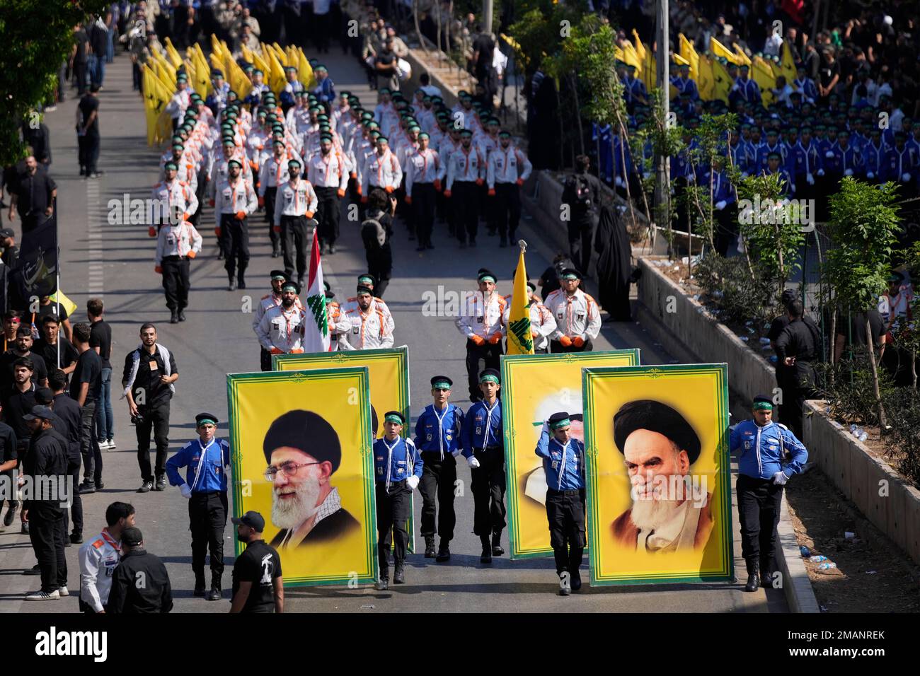Hezbollah al-Mahdi scouts carry portraits of of the late revolutionary ...