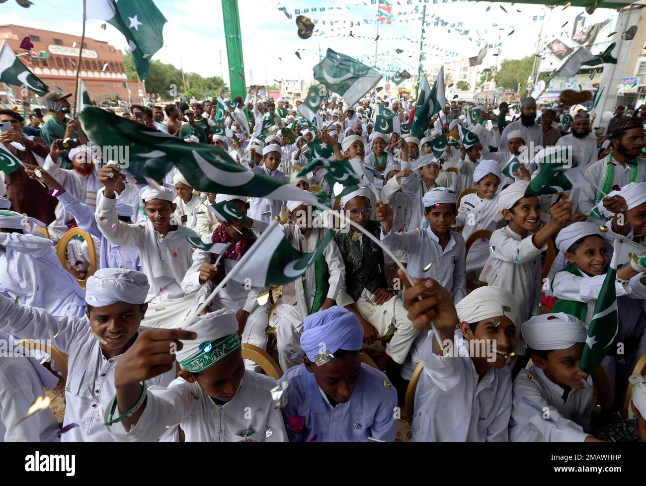People wave Pakistani flags at the mausoleum of Muhammad Ali Jinnah ...