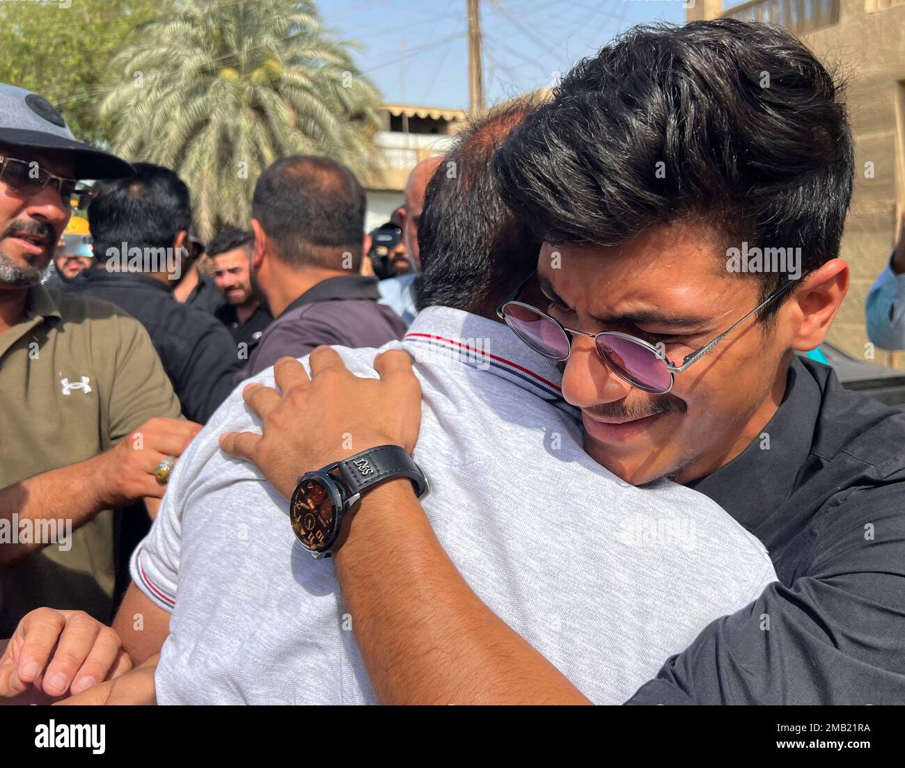 Men mourn Abbas Abdul Hussein, a 30-year-old victim of an artillery ...