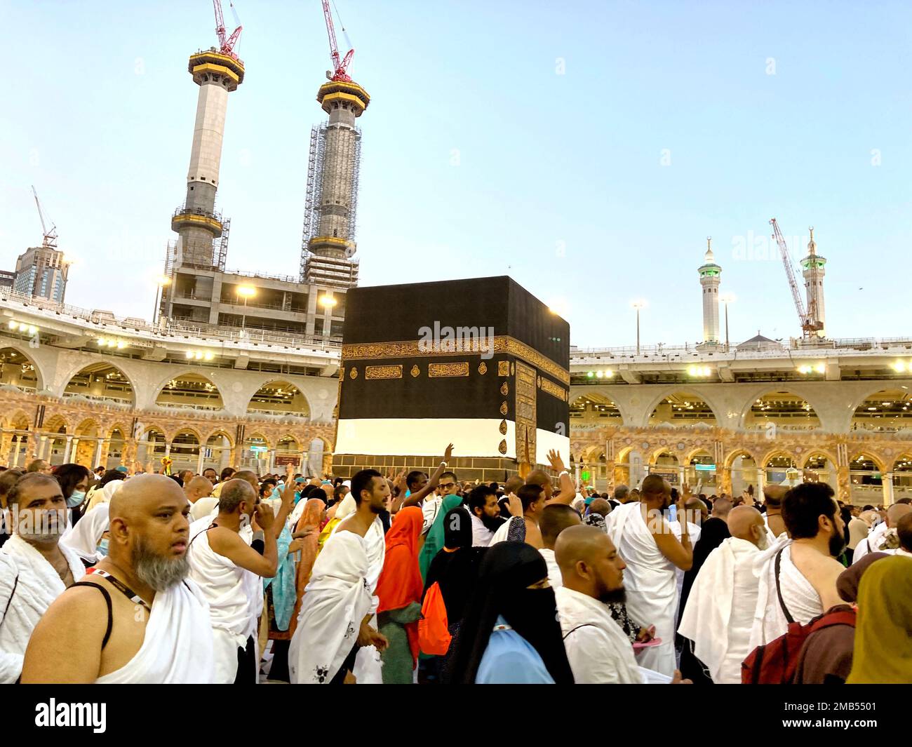 Thousands of Muslim pilgrims circumambulate around the Kaaba, the cubic ...