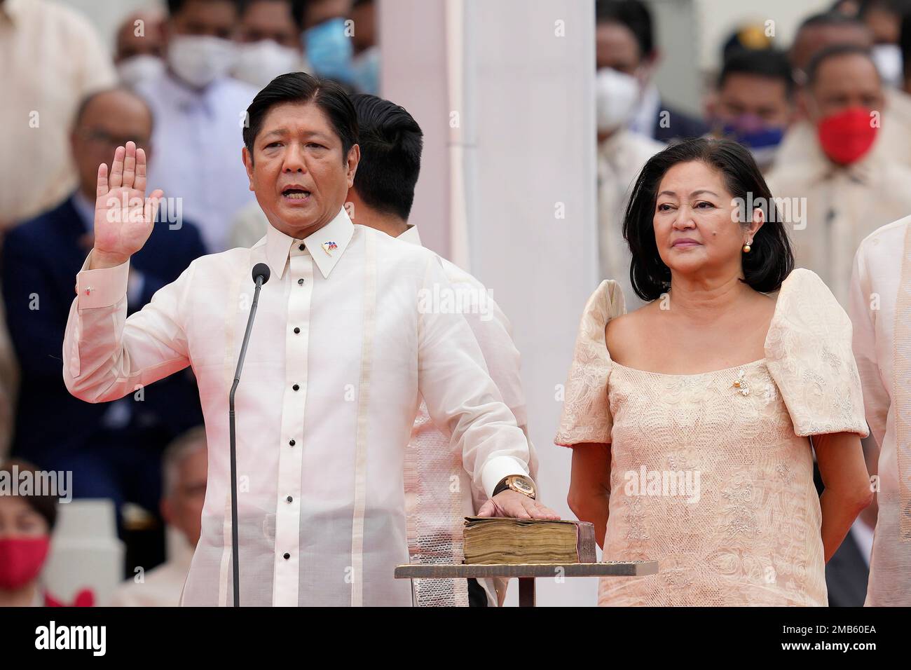 Philippine President-elect Ferdinand Marcos Jr., left, is sworn in ...