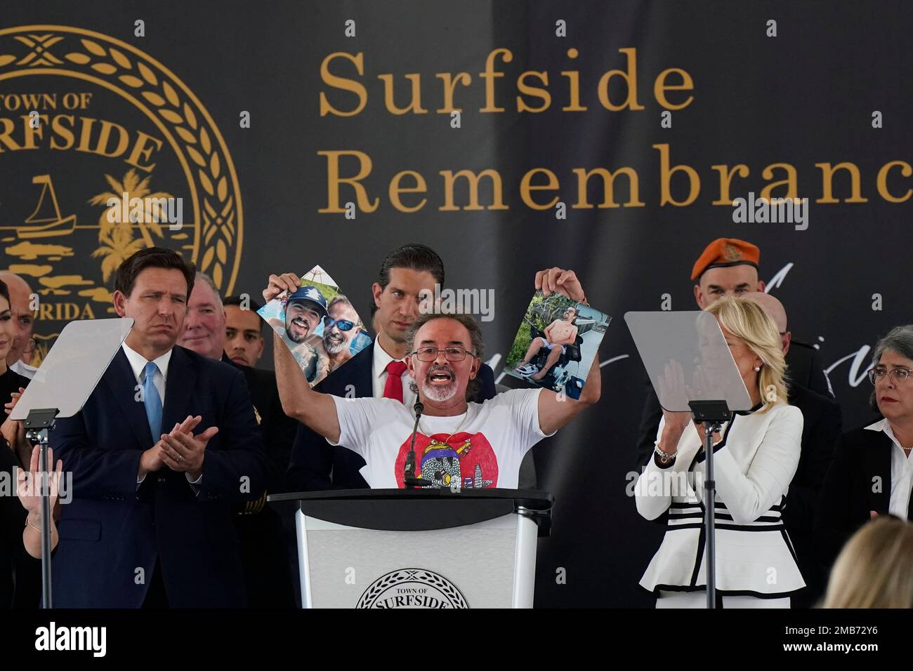 Luis Bermudez holds up photos of himself and his son, also named Luis ...
