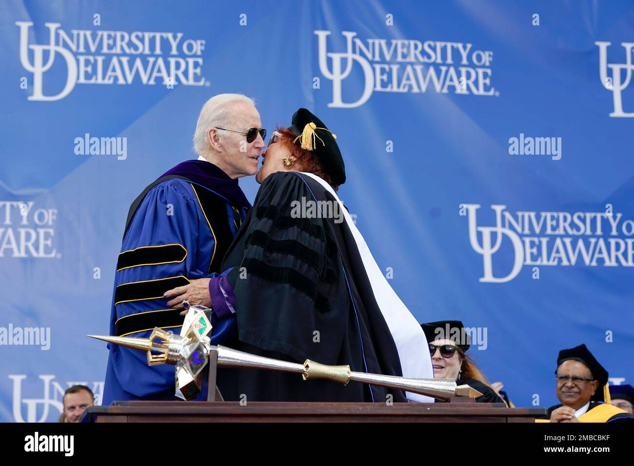 Honorary degree recipient Tatiana Copeland kisses President Joe Biden ...