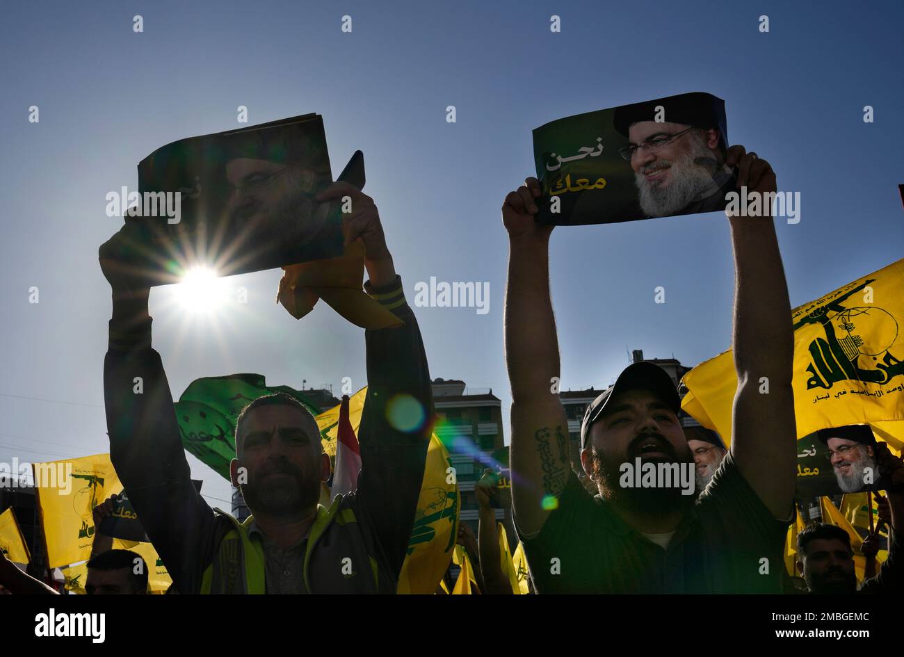 Hezbollah supporters hold up portraits of Hezbollah leader Sayyed ...