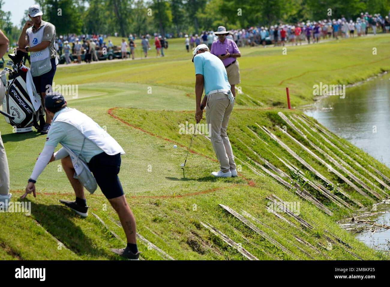 Christiaan Bezuidenhout, of South Africa, chips onto the ninth green ...