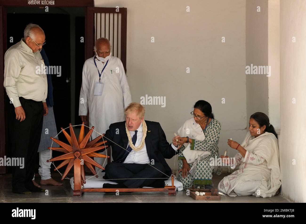 British Prime Minister Boris Johnson tries his hands on a spinning ...