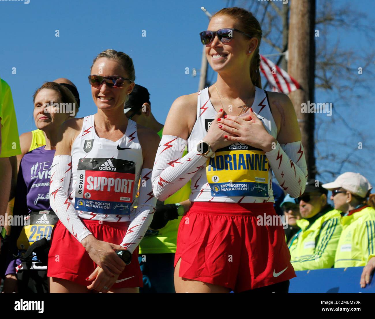 Boston Marathon bombing survivor Adrianne Haslet, right, reacts as she ...