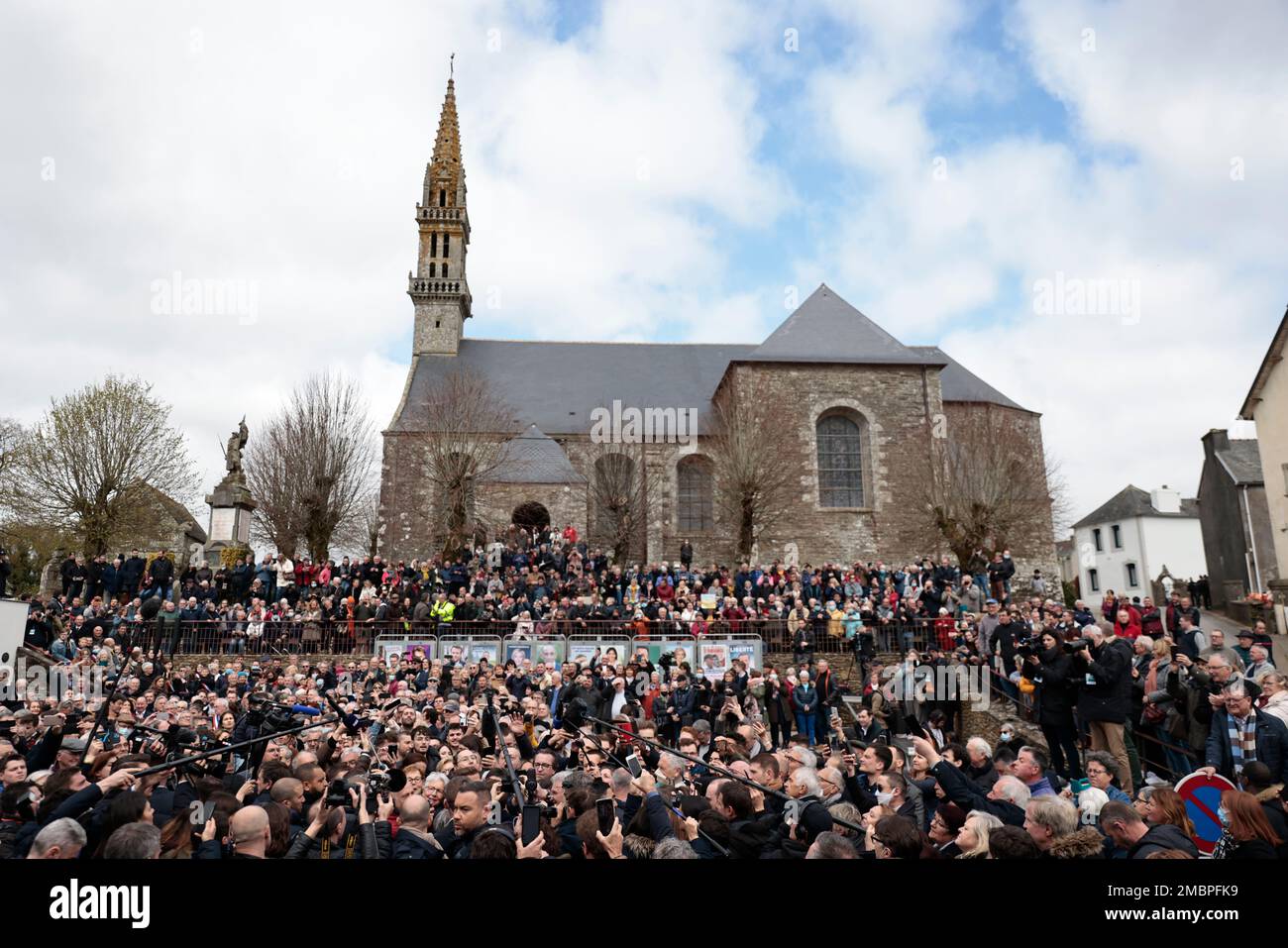 A crowd watch French President Emmanuel Macron and centrist candidate ...