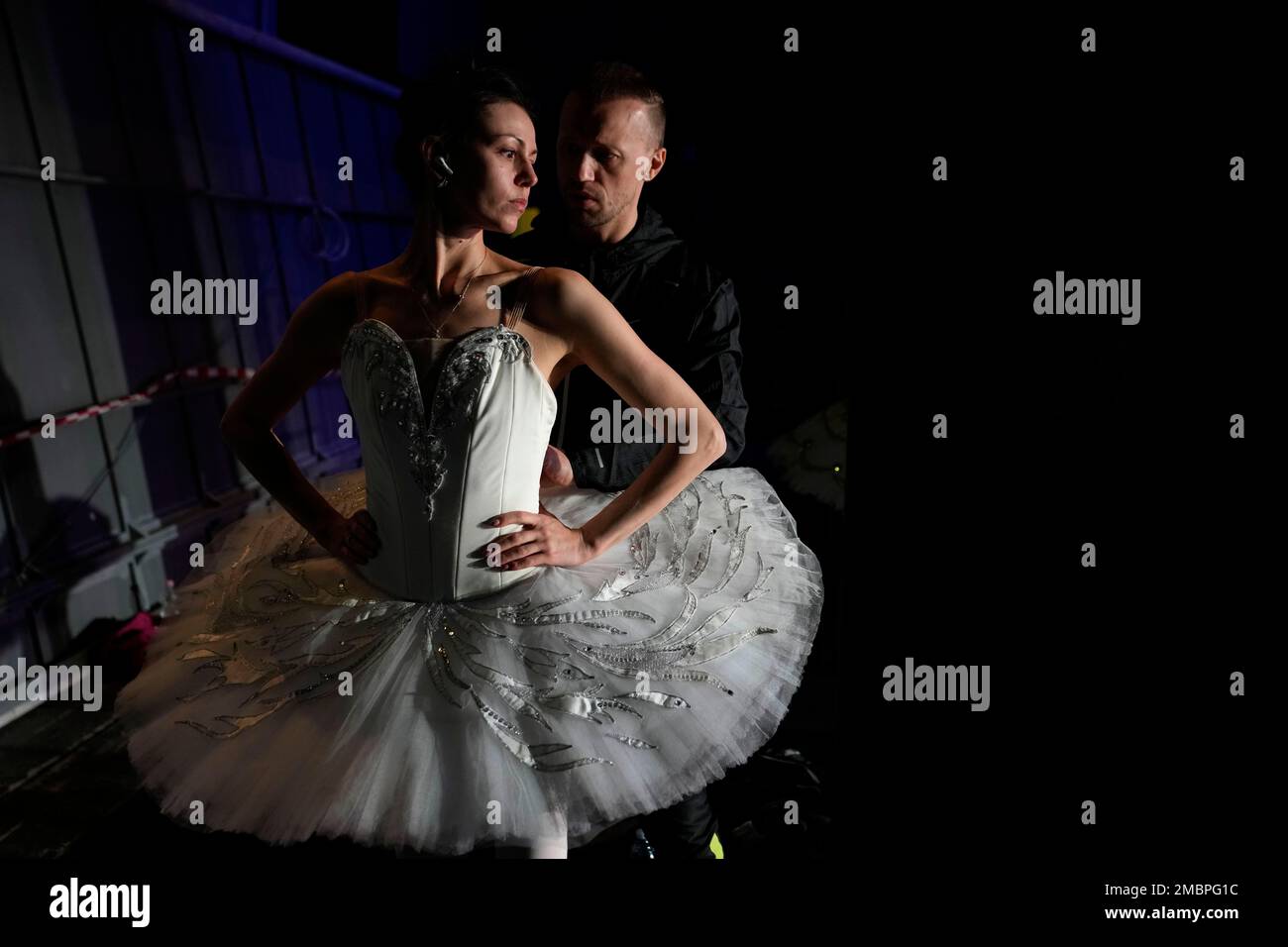Anastasia Matvienko, and her husband Denis Matvienko, both from Ukraine, warm up before a ...