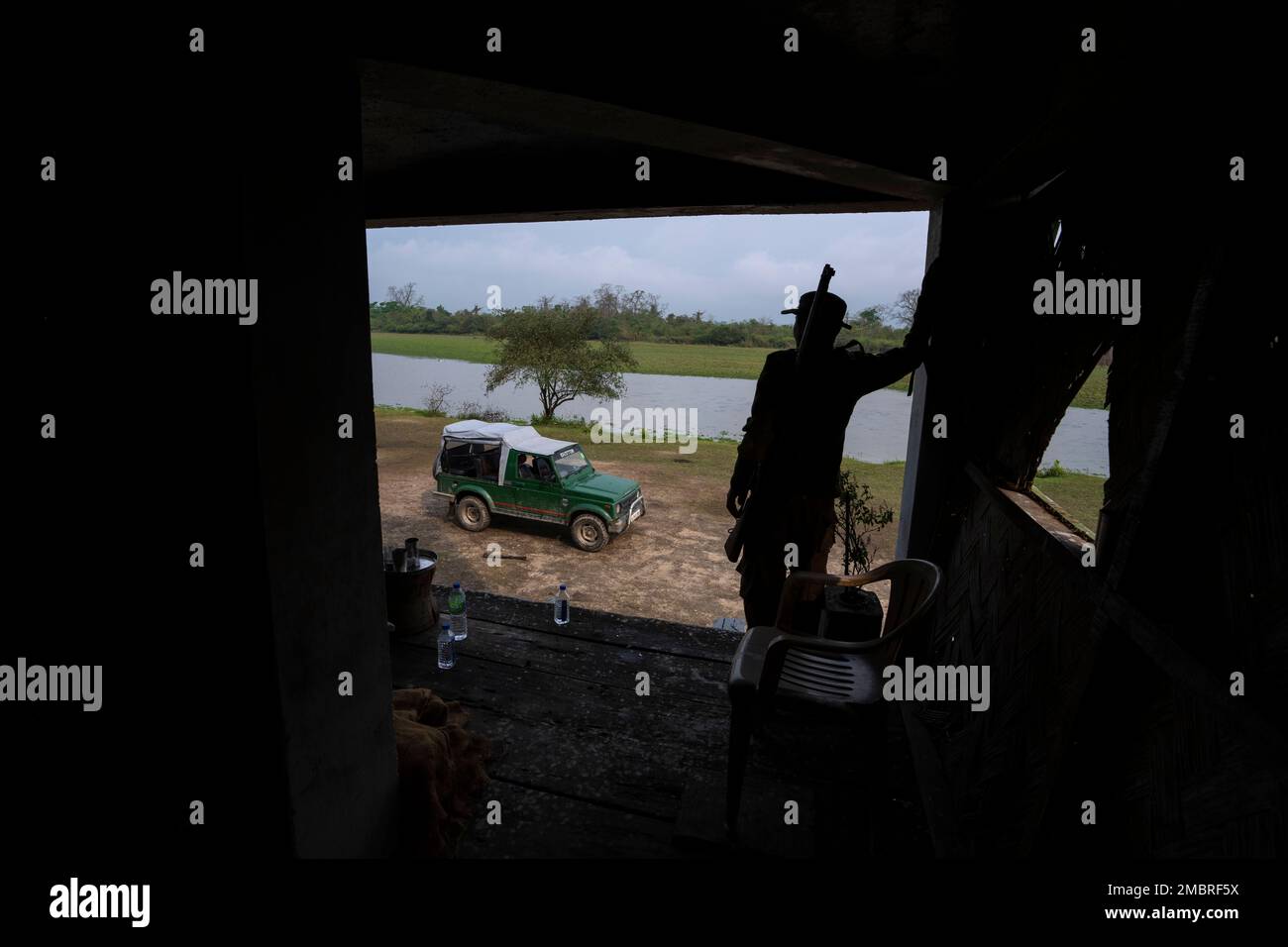 A forest officer stands guard during a census drive to count one-horned ...