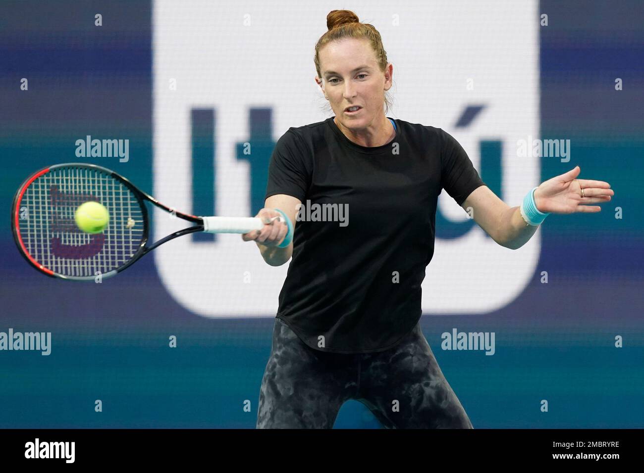 Madison Brengle returns the ball to Iga Swiatek of Poland, during the ...